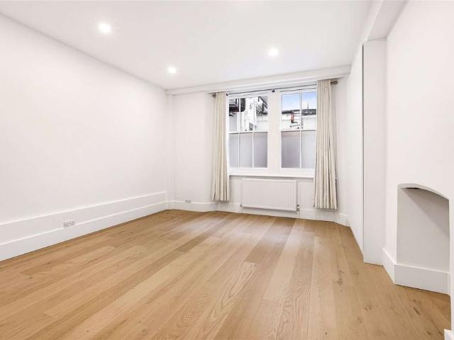A well proportioned two bedroom lower ground floor apartment with a study