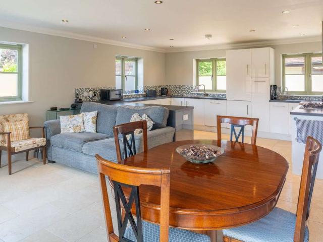 A wonderful modern country house to rent, in private gated gardens, enjoying a high degree of privacy and an outdoor swimming pool
