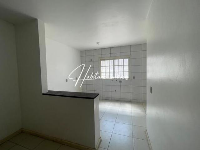 Aconchegante Apartamento Térreo com Conceito Aberto em Bairro Tranquilo!