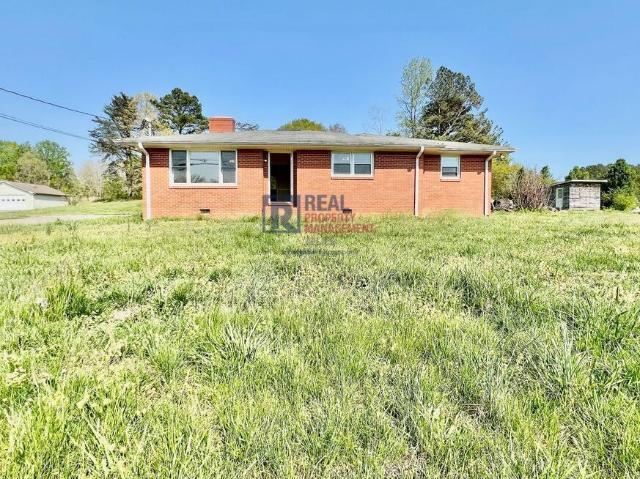 All Brick Ranch on Beautiful Land in White!