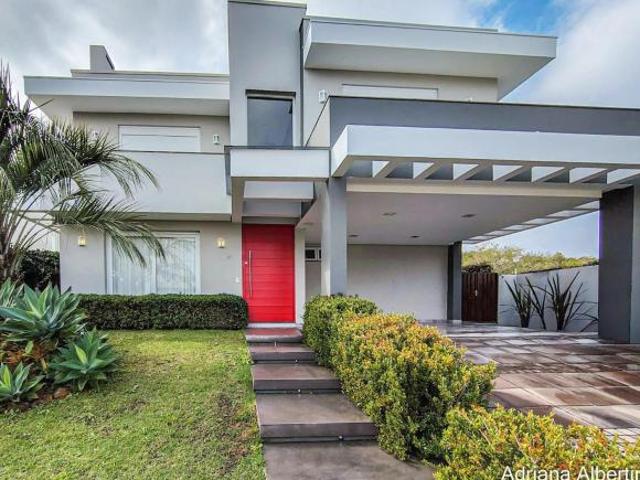 ALPHAVILLE PORTO ALEGRE | CASA COM FUNDOS PARA APP E ÁREA EXTERNA COMPLETA