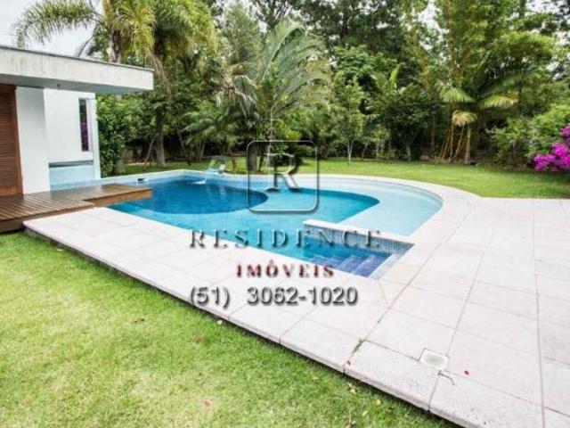 Aluguel de Casa de 453m² com 3 Suítes e 4 Vagas no Condomínio Terra Ville em Porto Alegre RS