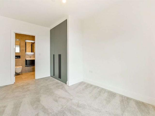 An unfurnished and upper floor two bedroom apartment with east facing private balcony in the Horlicks development