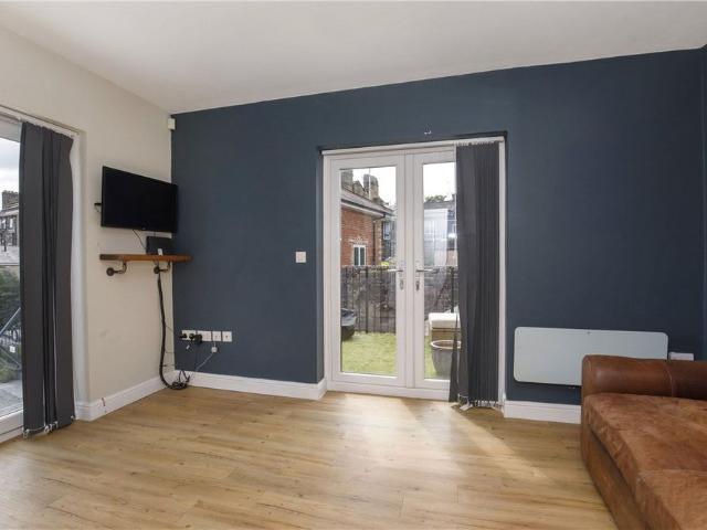 An attractive two double bedroom, semi detached mews style home, arranged over three floors, with amazing views over the bowling green, close to Harrogate Town Centre