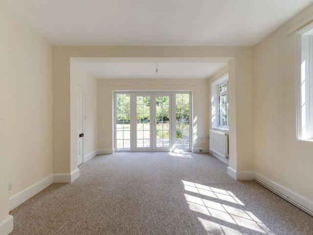 An elegant period country home of significant character set in four acres of secluded garden in a prime central location