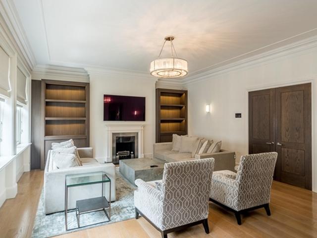 An exceptional three bedroom, north west facing, lateral apartment set within a Victorian red brick, Grade II listed, Queen Anne style period building