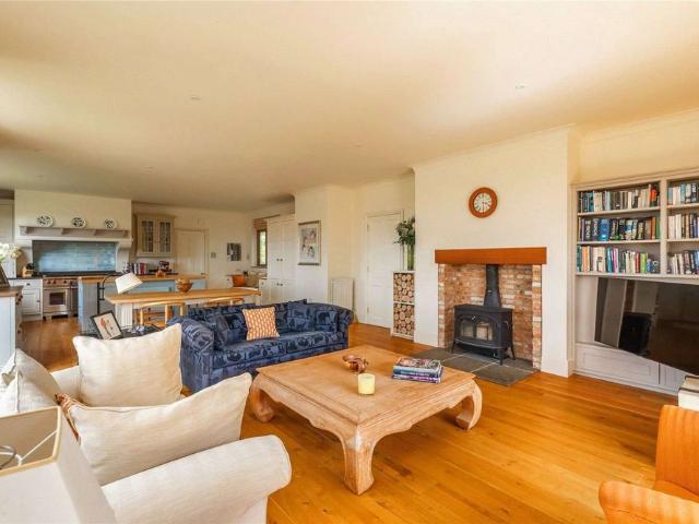 An exceptional detached family house situated on the edge of this highly sought after village with stunning views over open countryside