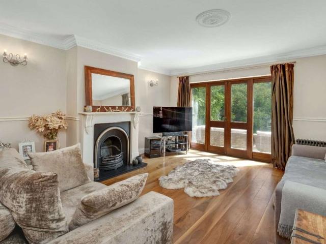 An exceptional extended family home, blending contemporary style with period charm. Set within beautifully landscaped gardens, it offers versatile and refined living throughout