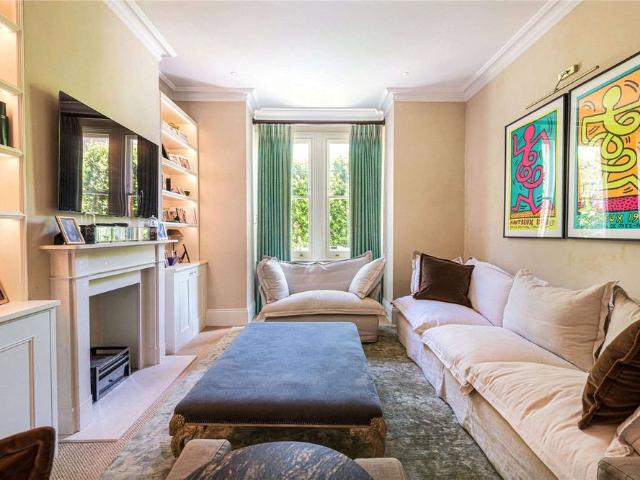 An exceptional four bedroom family home arranged over three beautifully designed levels, offering flexible living, refined interiors and a wonderfully private garden