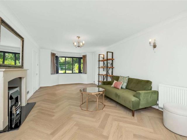 An exceptional four bedroom home offering generous living space, a private driveway and a beautifully established rear garden, positioned within a sought after residential setting