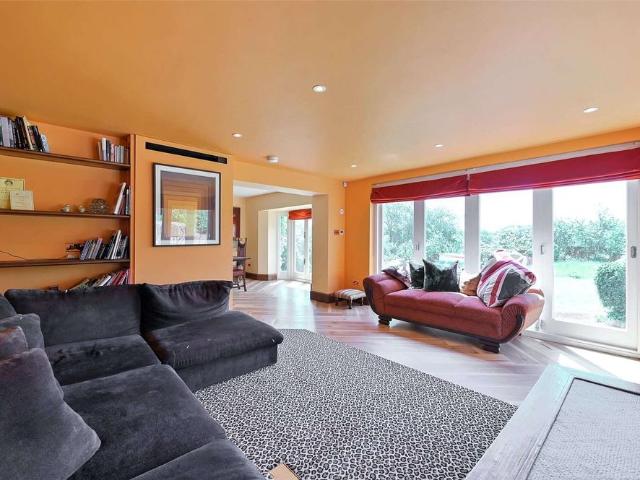 An exceptional furnished family home set within generous mature gardens, within the exclusive Rosehill estate