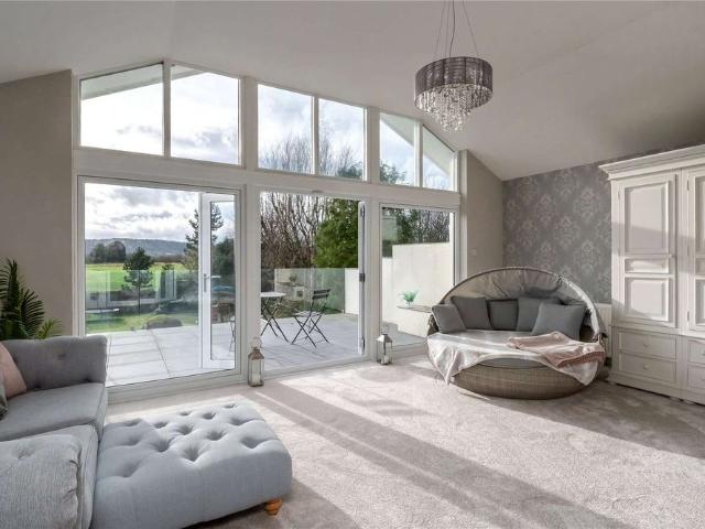An exceptional late 20th century six bedroom home offering expansive, elegant design & seamless indoor outdoor flow, within south facing gardens with stunning views