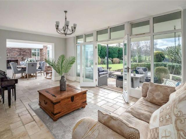 An exceptional late 20th century six bedroom home offering expansive, elegant design & seamless indoor outdoor flow, within south facing gardens with stunning views