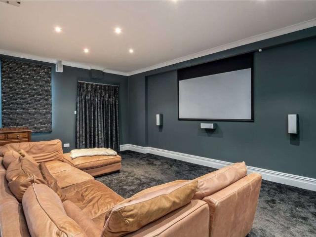An exceptional late 20th century six bedroom home offering expansive, elegant design & seamless indoor outdoor flow, within south facing gardens with stunning views