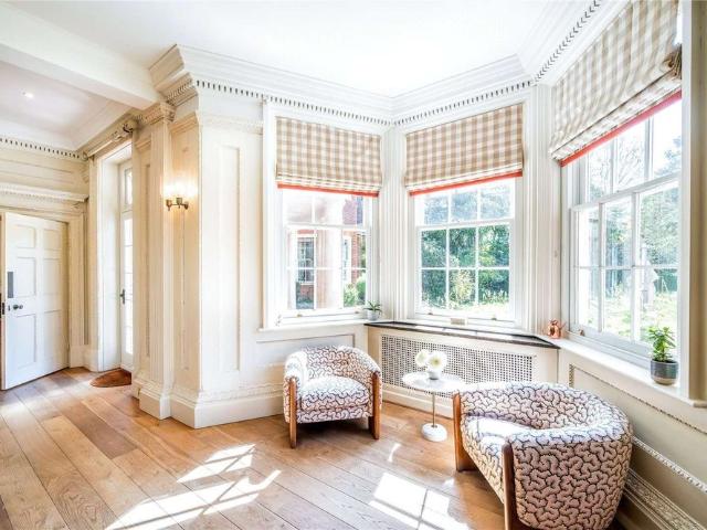 An exceptional seven bedroom Lutyens style country house set within a private gated estate in Hurley, with landscaped gardens, a picturesque lake and two studio annexes