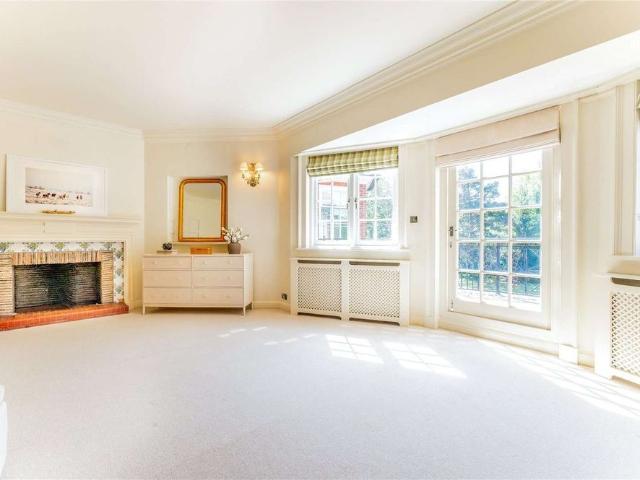 An exceptional seven bedroom Lutyens style country house set within a private gated estate in Hurley, with landscaped gardens, a picturesque lake and two studio annexes