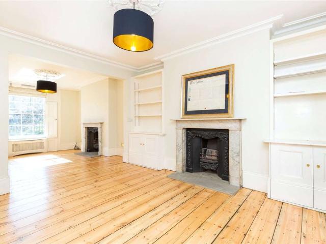 An exceptionally charming four bedroom house with a secluded garden set in the heart of Islington overlooking the Regent's Canal