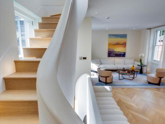 An exquisitely refurbished three bedroom Kensington townhouse, combining refined contemporary design with elegant period proportions, moments from Kensington Palace