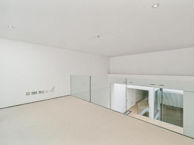 An impressive and versatile multi‑level family house arranged over five floors with generous living space, mezzanine studio and four bedrooms, set on one of Kensington’s most elegant garden squares