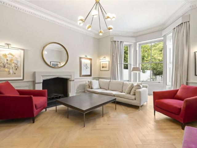 An impressive five bedroom home with gated driveway