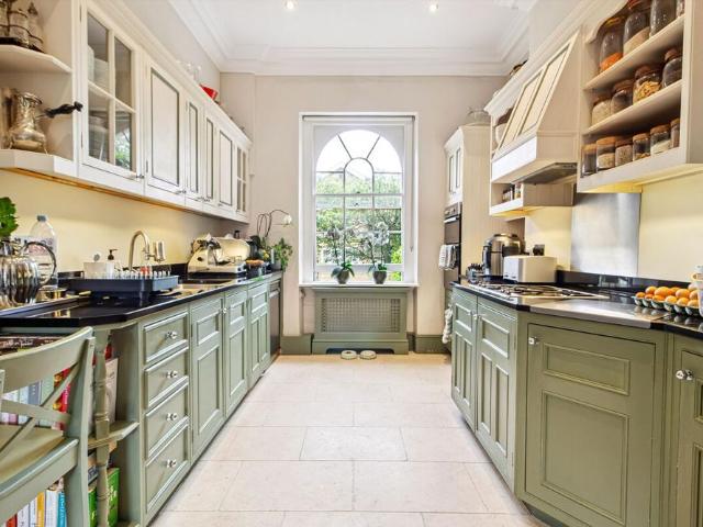 An impressive, wide‑fronted period townhouse with generous entertaining space and private terraces set within one of Kensington’s most desirable garden squares