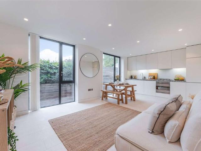 An interior designed, two bedroom apartment in this modern & popular development