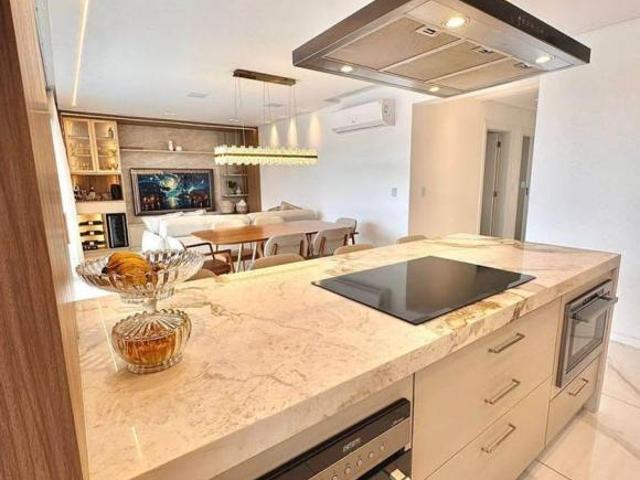 Ap com 78 metros², 3 quartos, churrasqueira e varanda gourmet em Riviera Bertioga SP
