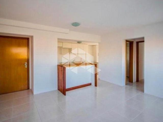 Apartamento 02 dormitórios com 65,00m2, 01 vaga coberta, desocupado, no Bairro Tristeza