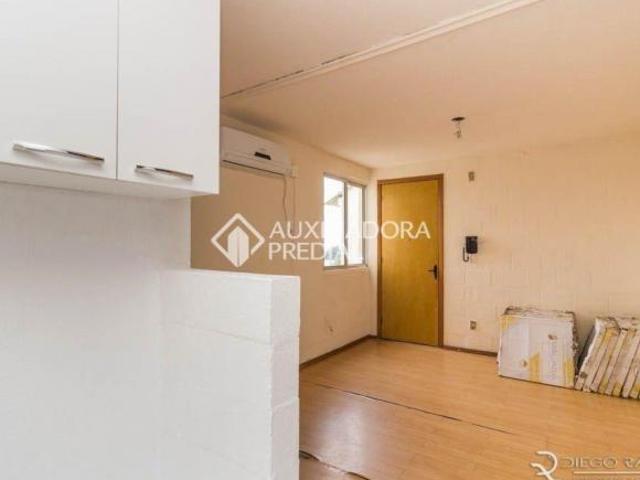 APARTAMENTO: 02 Dormitórios, living com split, cozinha americana.l
