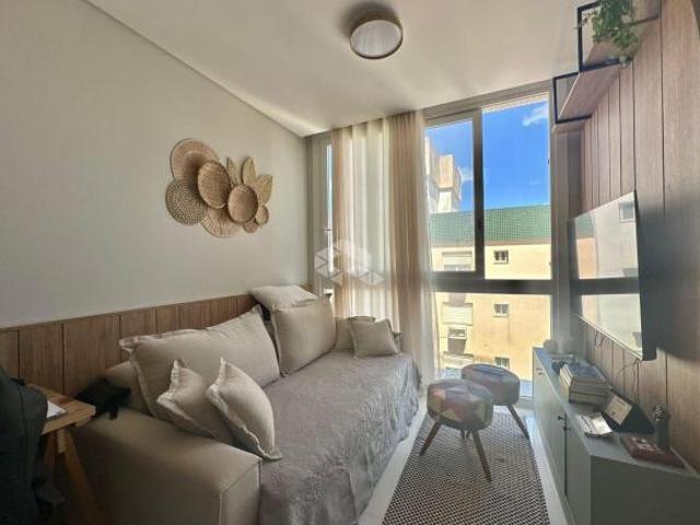 Apartamento 1 dormitório com suíte e vista mar no centro de Capão da Canoa