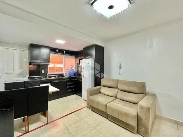 Apartamento 2 dormitórios mobiliado com vaga de garagem no centro de Capão da Canoa