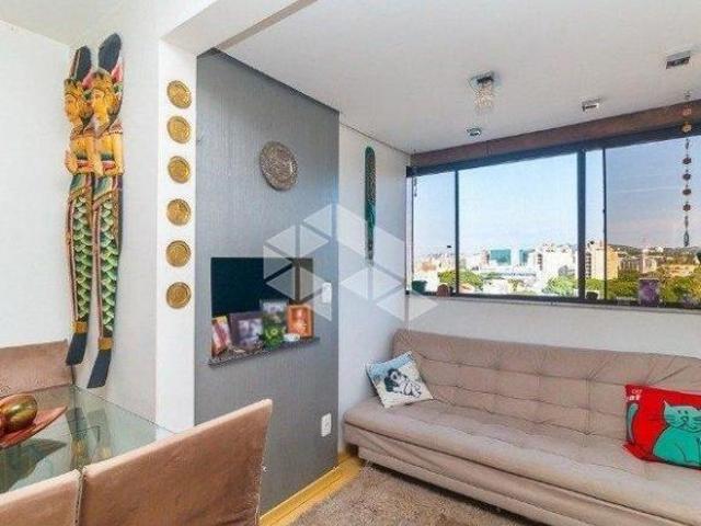 Apartamento 2 dormitórios com sacada e garagem para venda no bairro Cidade Baixa em Porto Alegre/RS