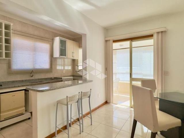 Apartamento 2 dormitórios, sendo 1 suíte, mobiliado, sacada com churrasqueira, de frente com box e d