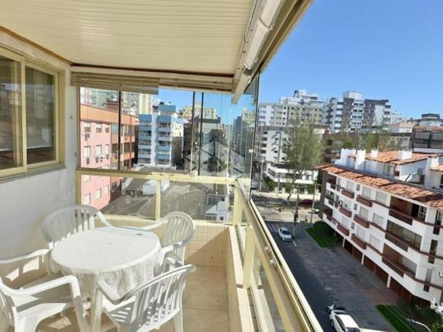 Apartamento 2 dormitórios, sendo 1 suíte, mobiliado, sacada com churrasqueira, de frente com box e