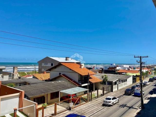 Apartamento 2 dormitórios, sendo 1 suíte, mobiliado, vista para o mar e 1 box de