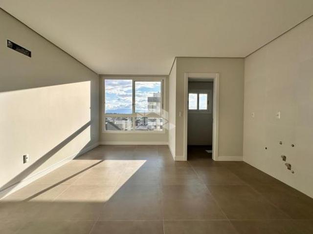 Apartamento 2 dormitórios, sendo 1 suíte, vazio com box no Centro de Capão da Canoa