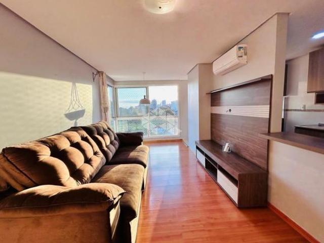 Apartamento 2 Dormitórios, 1 suíte, 2 vagas de garagem, sacada, churrasqueira. Nossa Senhora das Gra