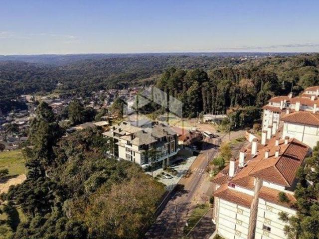 Apartamento 2 dormitórios 1 suíte + lavabo, com 68,08m² privativos no Centro de Gramado