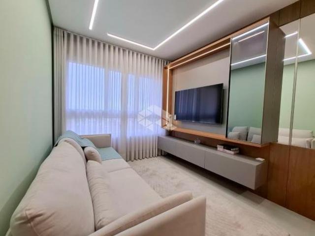 Apartamento 2 dormitórios/suítes, lavabo, mobiliado e decorado com 1 box/vaga de garagem no Centro d