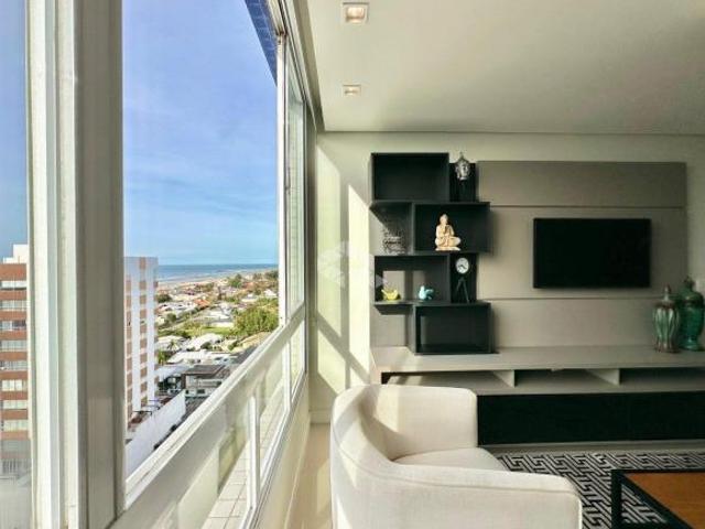 Apartamento 3 dormitórios, mobiliado, com sacada de frente e vista para o mar, 1 box/vaga de garagem