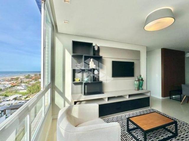 Apartamento 3 dormitórios, mobiliado, com sacada de frente e vista para o mar, 1 box/vaga de garagem