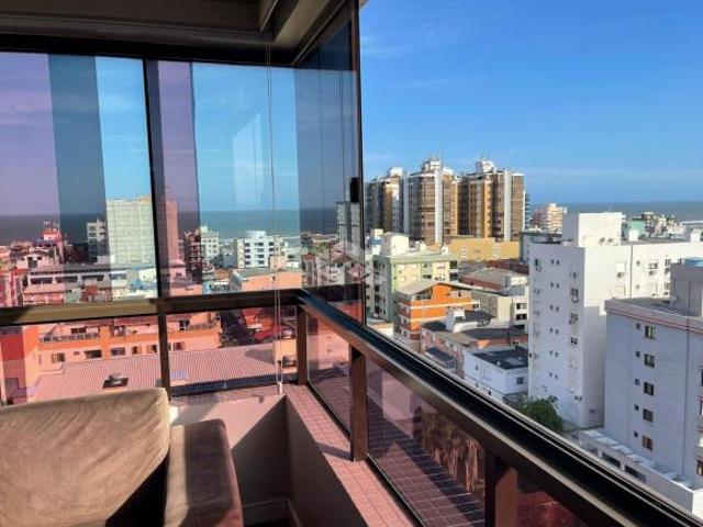 Apartamento 3 dormitórios/quartos, mobiliado com vista mar e serra e 2 box/vagas de garagem no centr