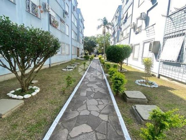 Apartamento térreo de 2 dormitórios, localizado na Rua Padre Ângelo Corso