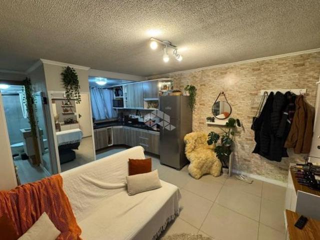 Apartamento térreo semi mobiliado de 2 quartos bem localizado na Vila Nova