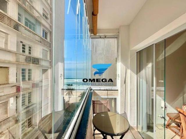 Apartamento à venda na praia das Pitangueiras no Guarujá I Omega Imoveis