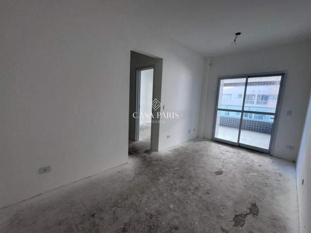 Apartamento à venda na Praia Grande Caiçara com vista mar, varanda gourmet e lazer completo