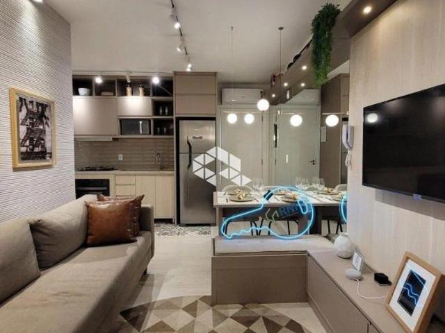 Apartamento à venda no bairro Igara em Canoas RS 2 dormitórios, sacada com churrasqueira, vaga cob
