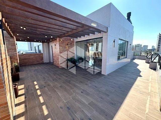 Apartamento à venda no Centro de Tramandaí com 2 dormitórios e garagem