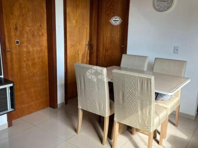 Apartamento a venda de 2 dormitórios semimobiliado em condomínio com vaga na Res