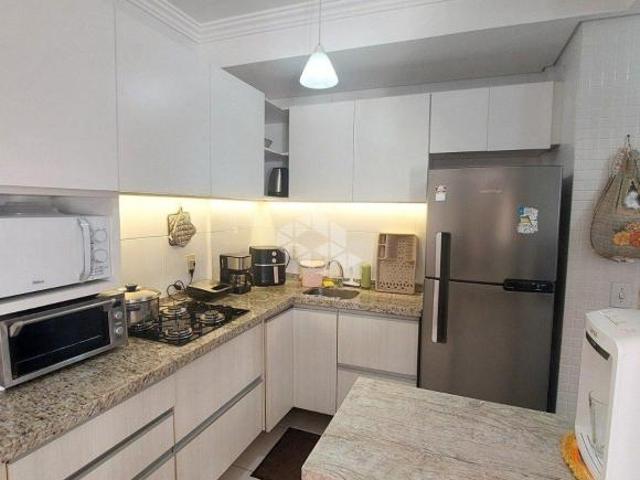Apartamento à venda em Capão da Canoa, 2 dormitórios, 1 suíte, vaga de garagem e excelente localizaç
